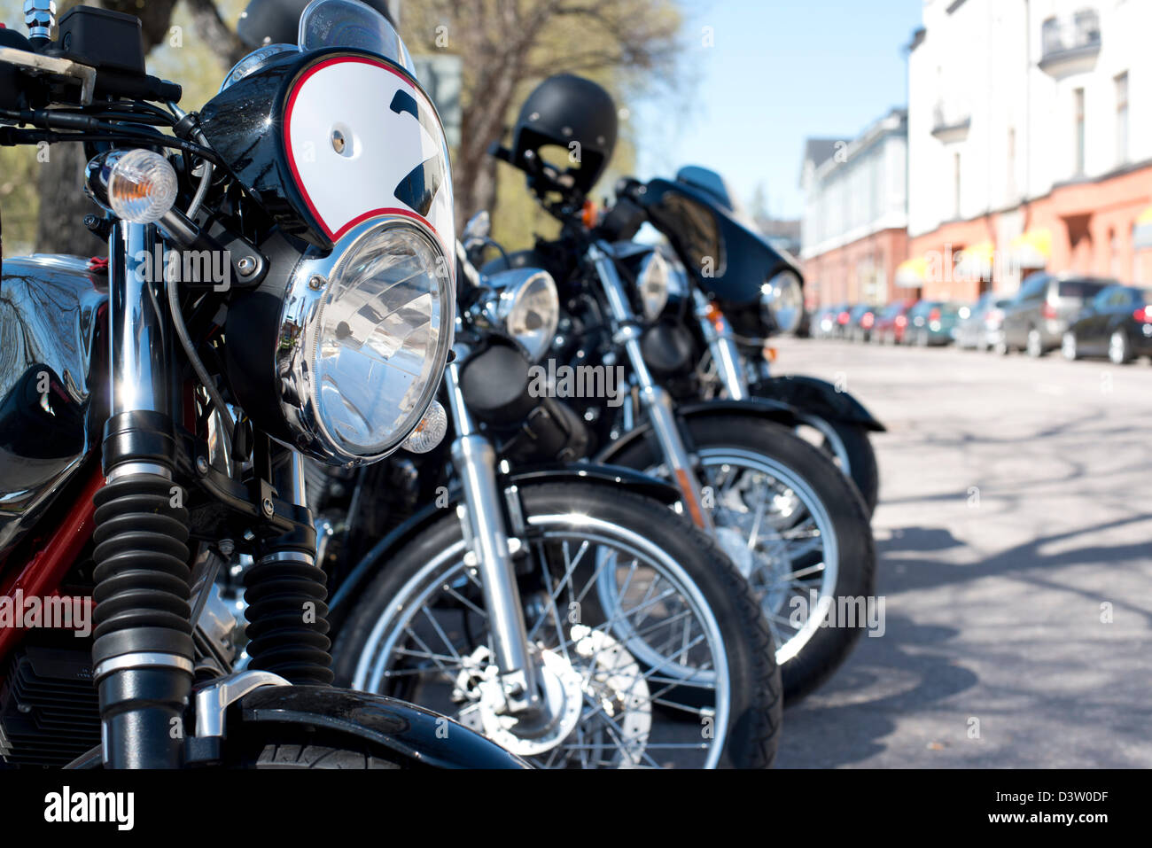Motorbikes lined op on a parking lot on the street Stock Photo - Alamy