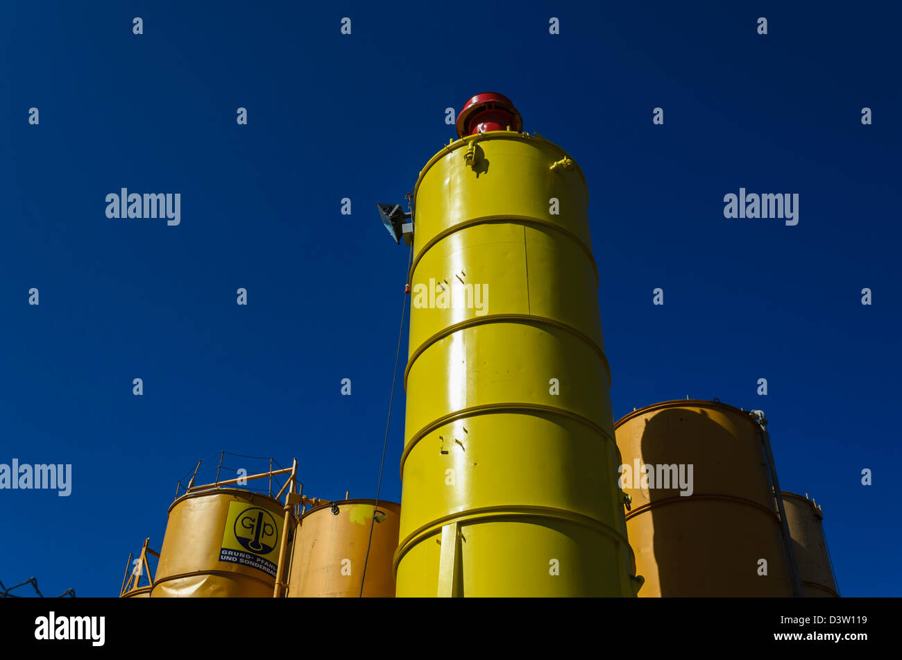 Yellow containers at road construction site Stock Photo - Alamy