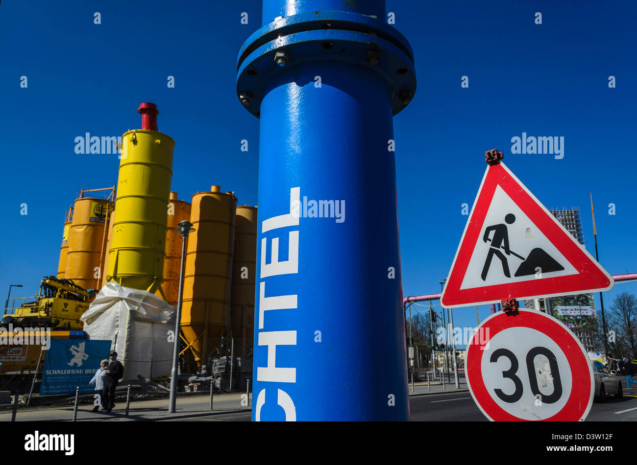 Yellow containers at road construction site Stock Photo - Alamy