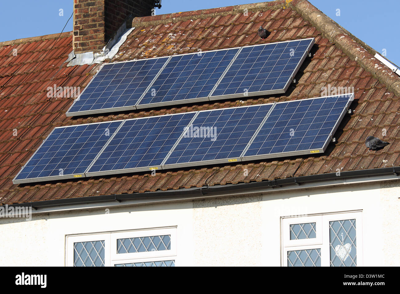 Solar photovoltaic panel roof array Stock Photo - Alamy