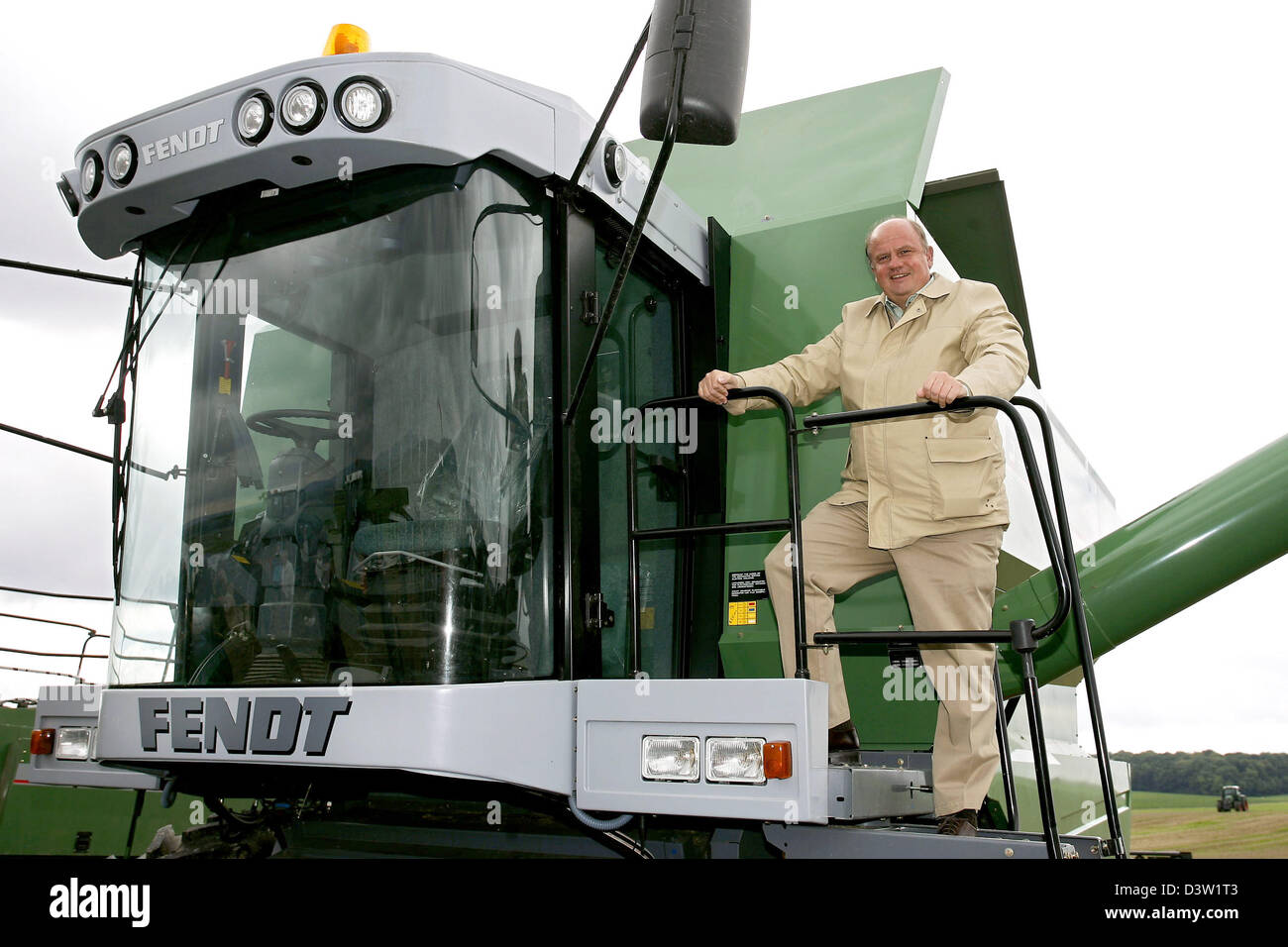 CEO of AGCO Martin Richenhagen poses on a tractor by Fendt on a field ...