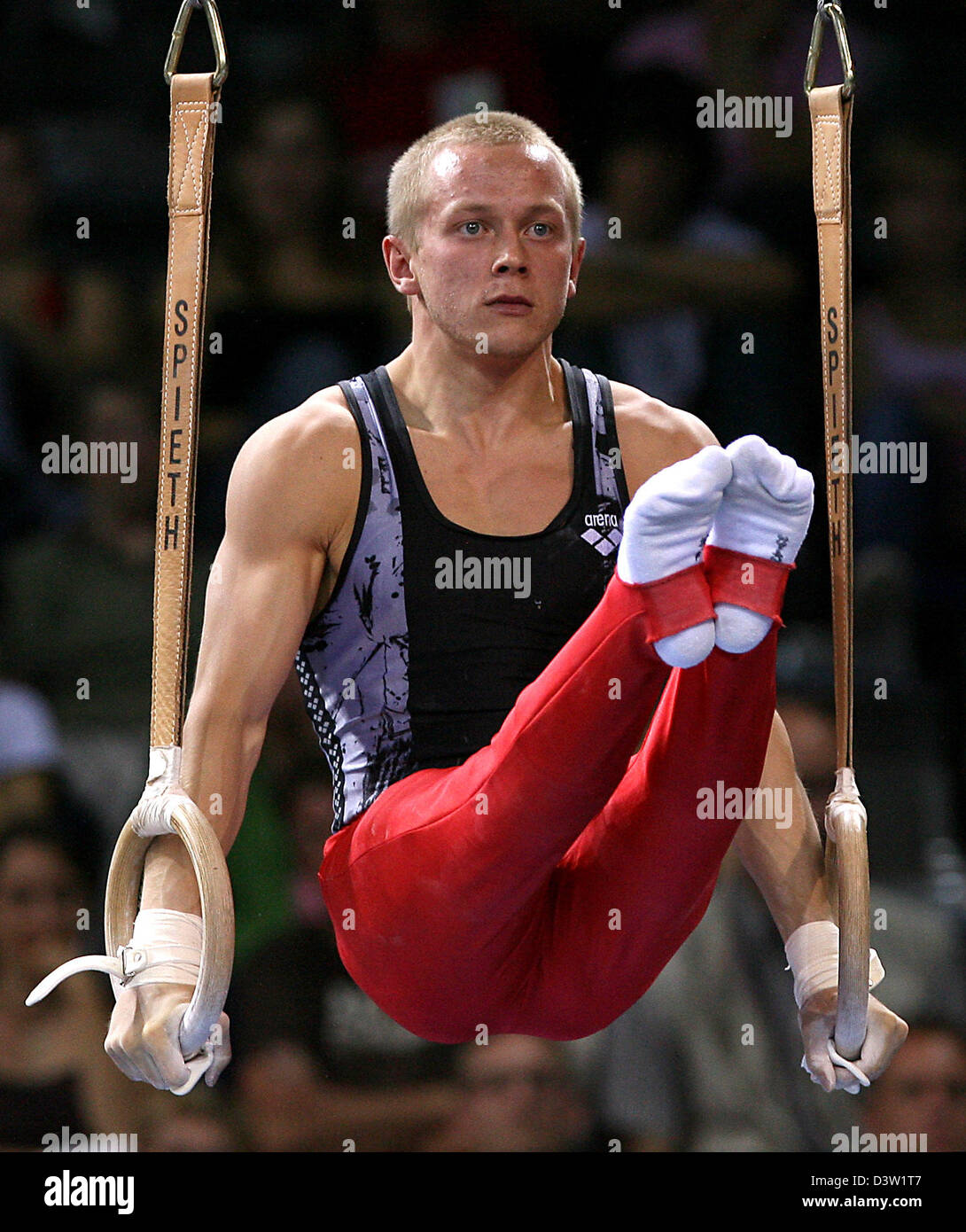The photo shows German athlete Eugen Spiridonov during the rings competition of the German ...