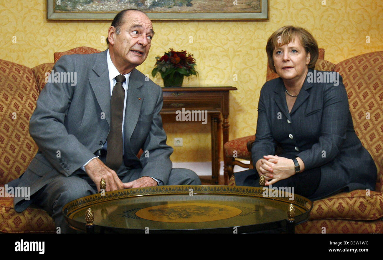 German Chancellor Angela Merkel (R) chats with French President Jacques ...