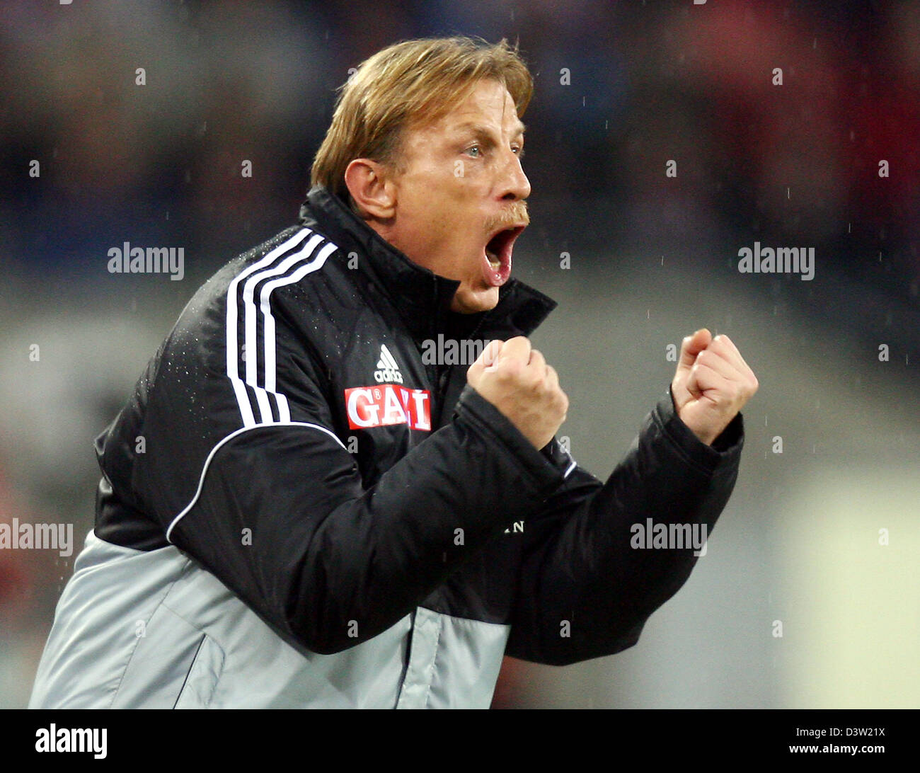 Cologne's head coach Christoph Daum gestures angrily during the ...