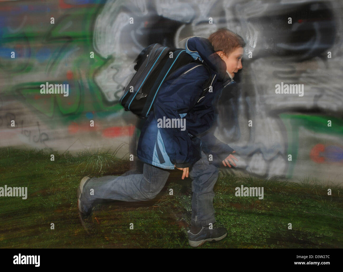 The symbolic picture shows a boy running from fighting classmates in ...
