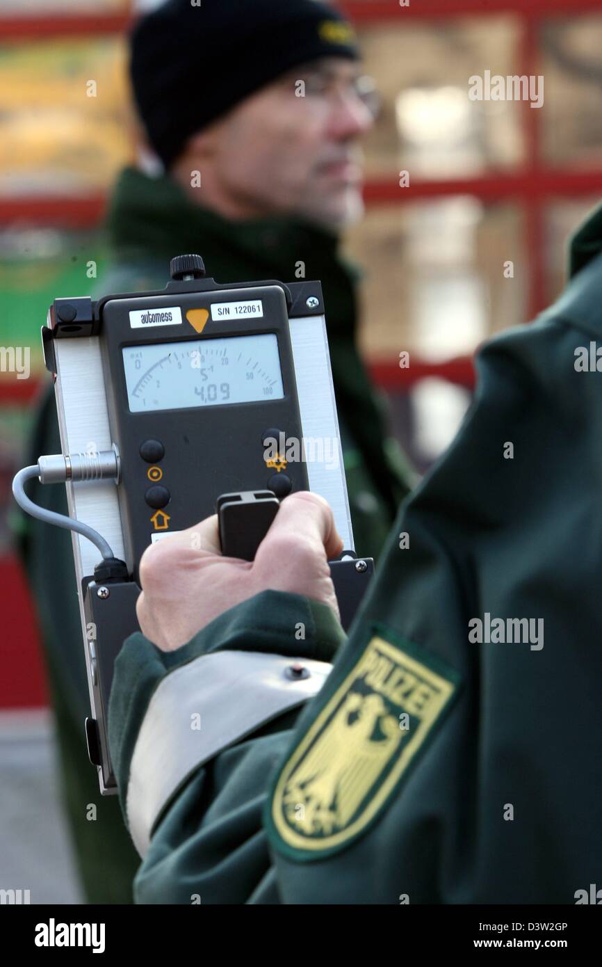 Police officers pictured with a Geiger counter in Hamburg, Germany ...