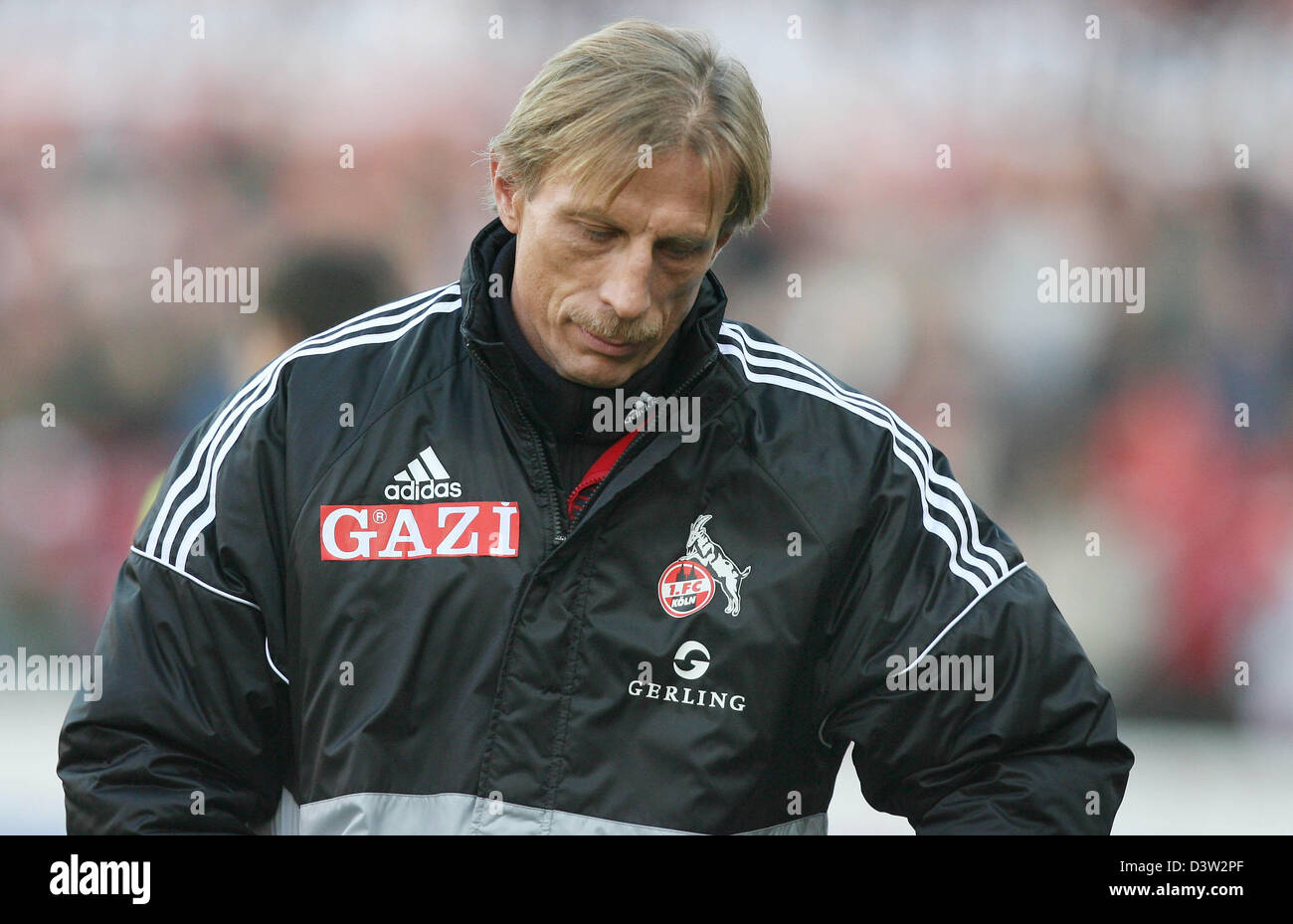 Cologne head coach Christoph Daum leaves disappointed the pitch after ...