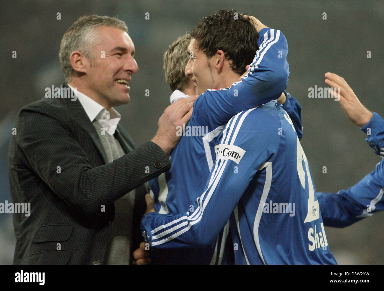 Schalke striker Peter Loevenkrands (C) cheers with his team mate Kevin ...