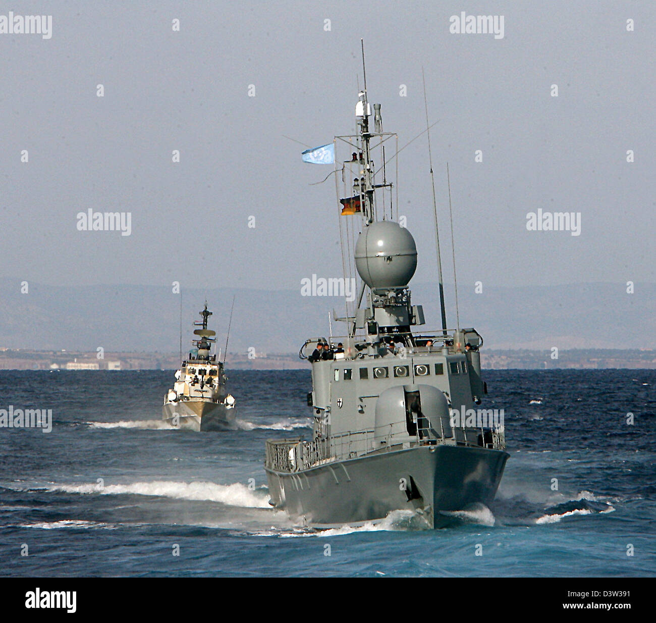 A German navy speedboat cruises in front of a speedboat of the ...