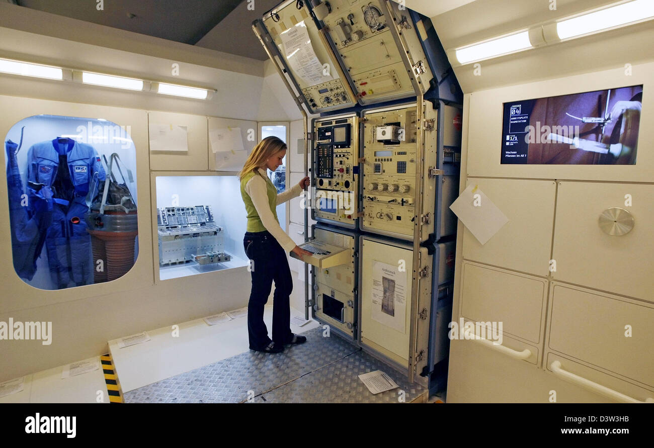 A woman eyes the original Anthrorack laboratory for integrated research ...