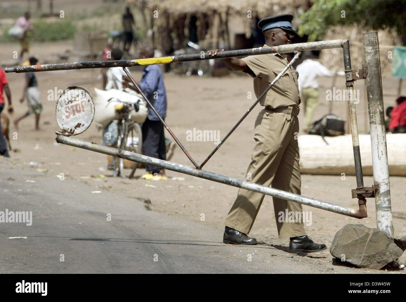 (dpa files) - A soldier opens a barrier near the village of Dzimbiri ...