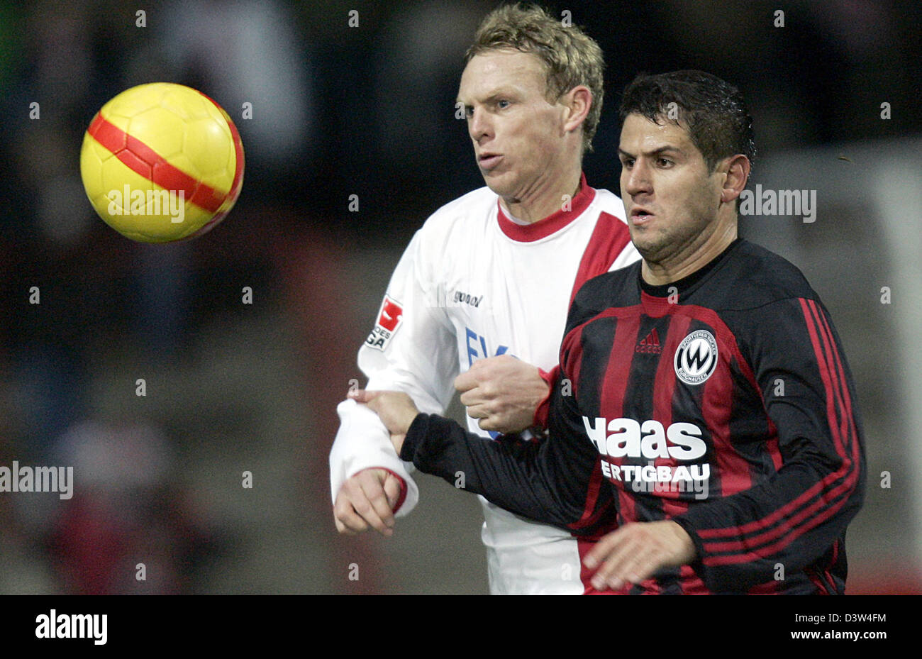 Offernbacher Kickers' Markus Happe (L) vies for the ball with SV Wacker ...