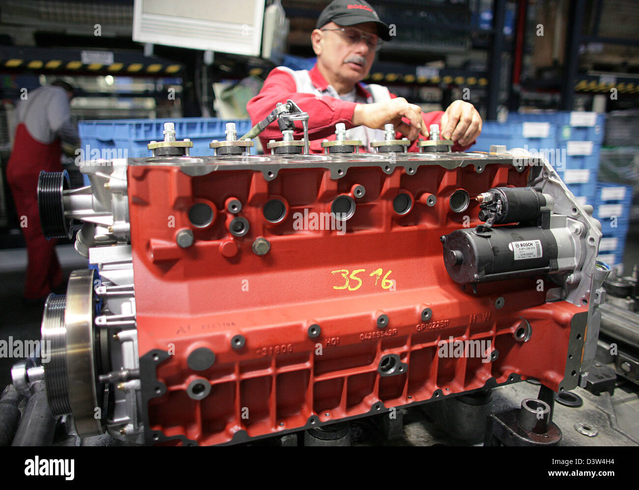 An employee of 'Deutz AG' screws at an engine in the facility Eli in ...