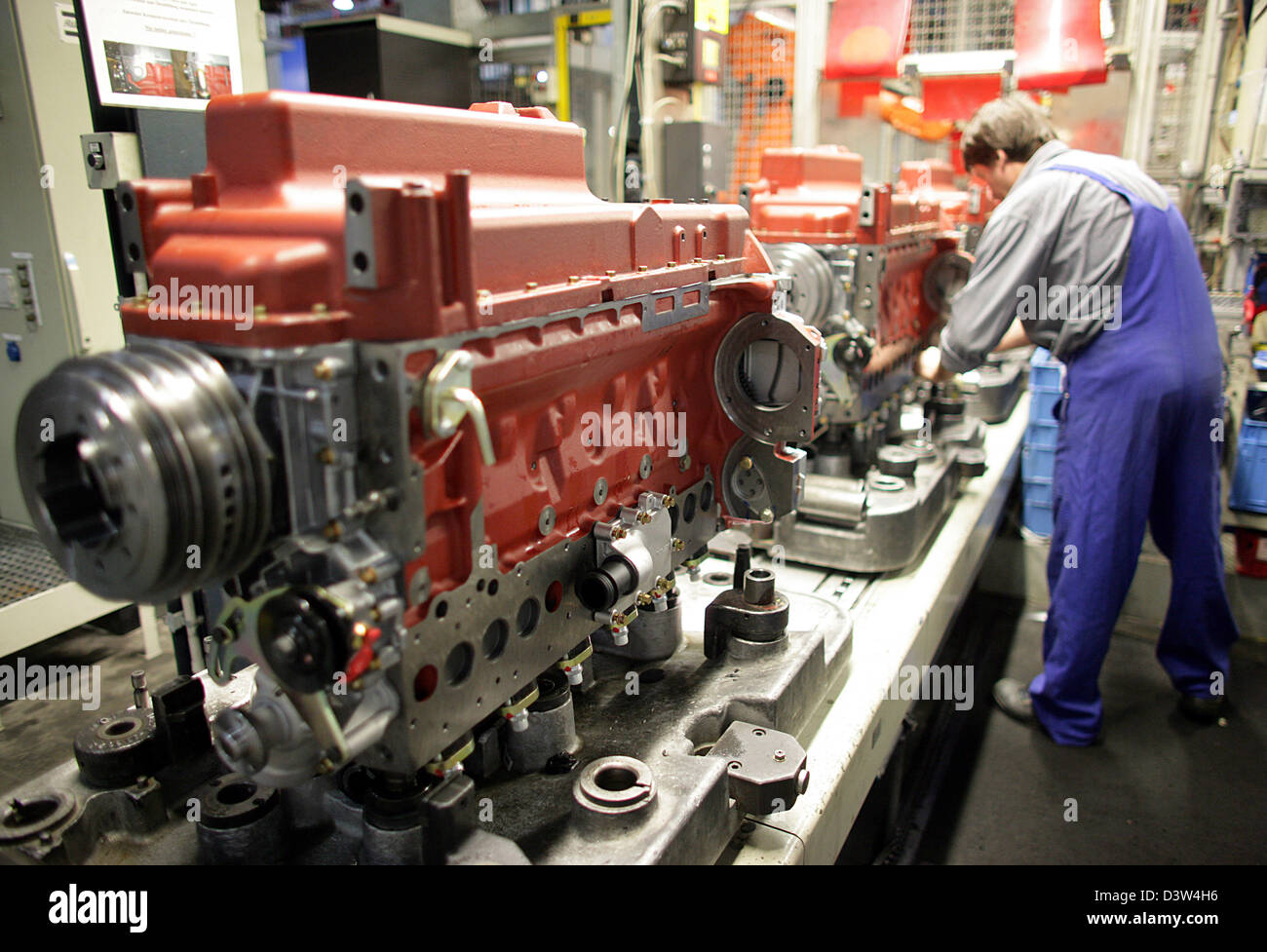 An employee of 'Deutz AG' screws at an engine in the facility Eli in ...