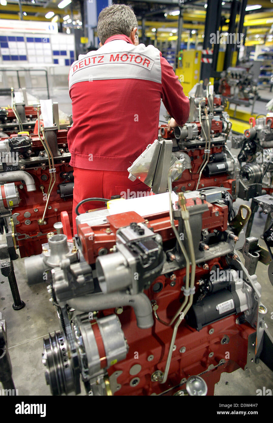 An employee of 'Deutz AG' screws at an engine in the facility Eli in ...