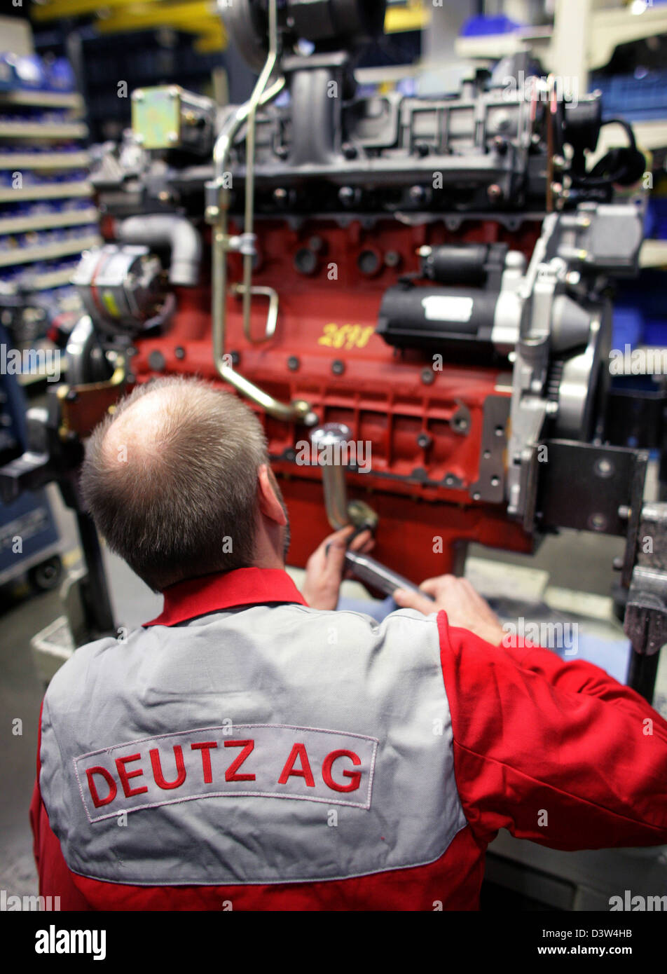 An employee of 'Deutz AG' screws at an engine in the facility Eli in ...
