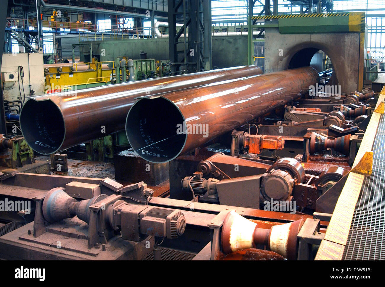 Pipes go through a washing plant at Mannesmann-pipes factory building ...