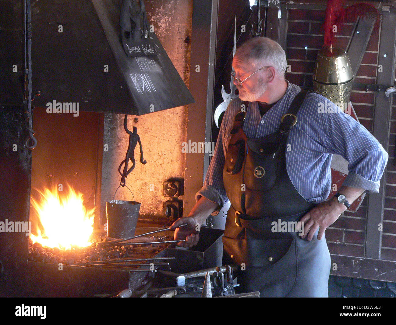 A blacksmith is pictured at work in his garage in Cologne, Germany, 01 ...