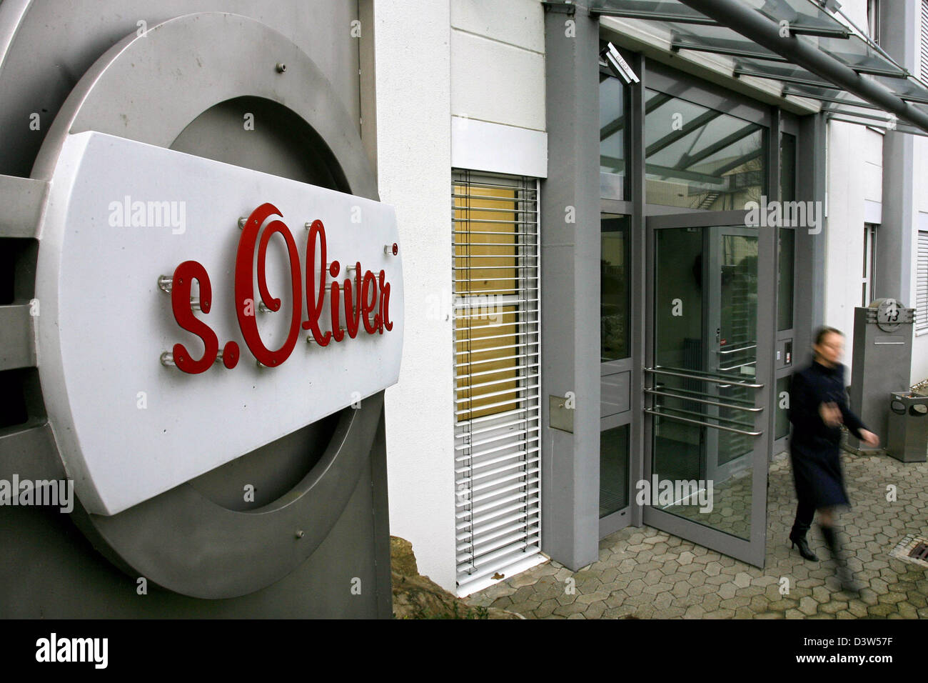 An employee leaves the administration building of fashion and lifestyle ...