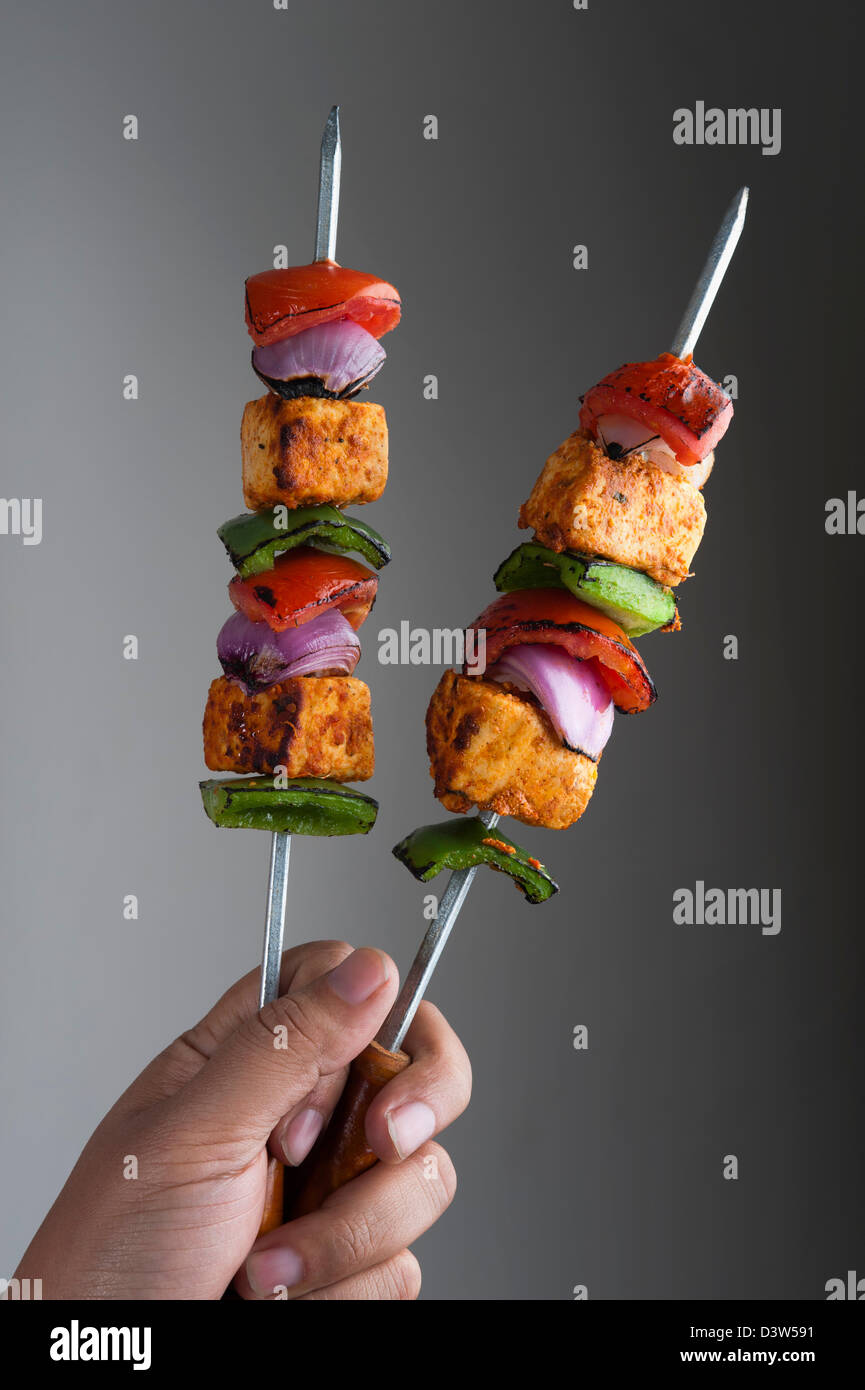 Close up persons hand holding kebab hi-res stock photography and images ...