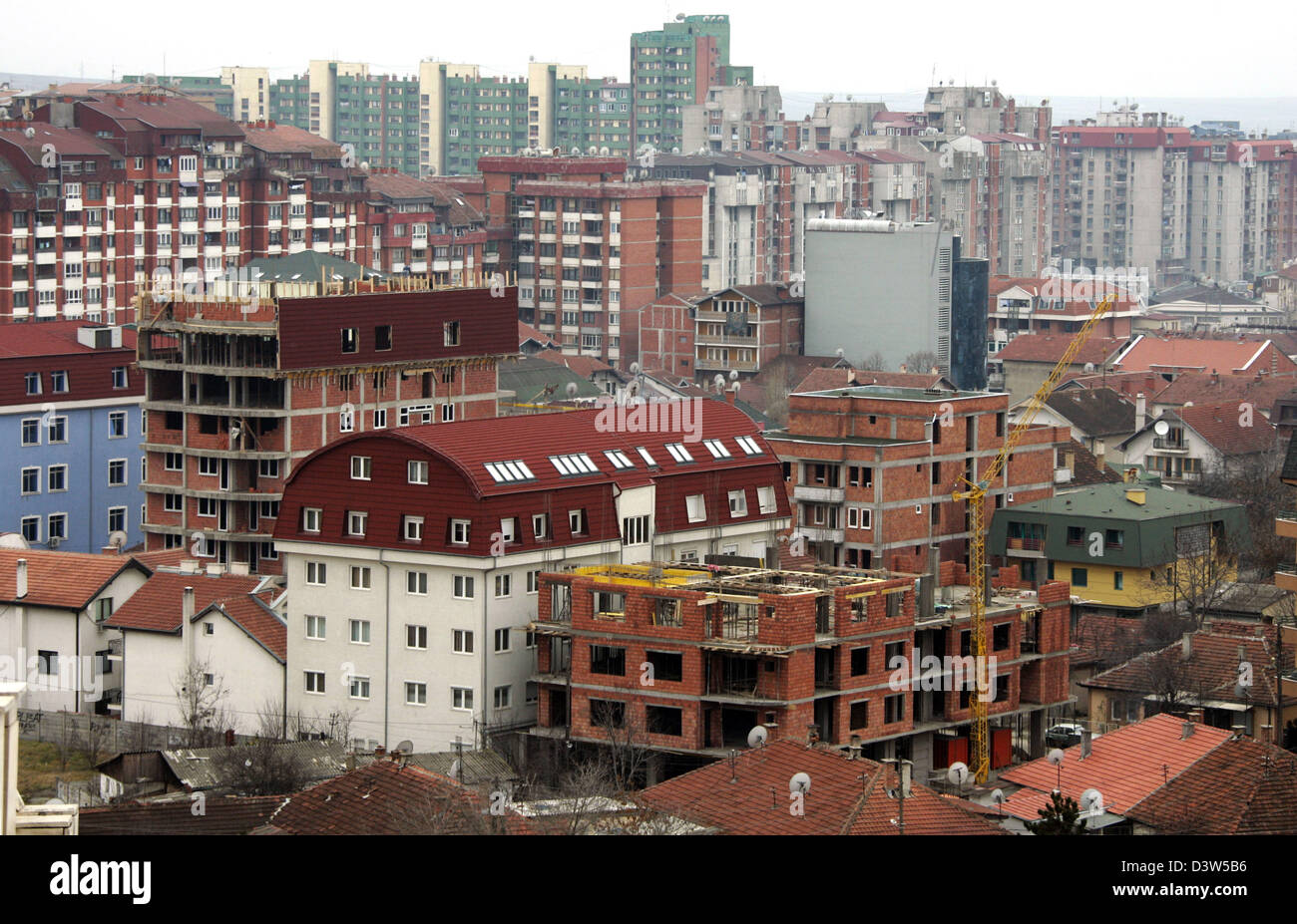 The picture shows multi-storey buildings and construction sites of ...