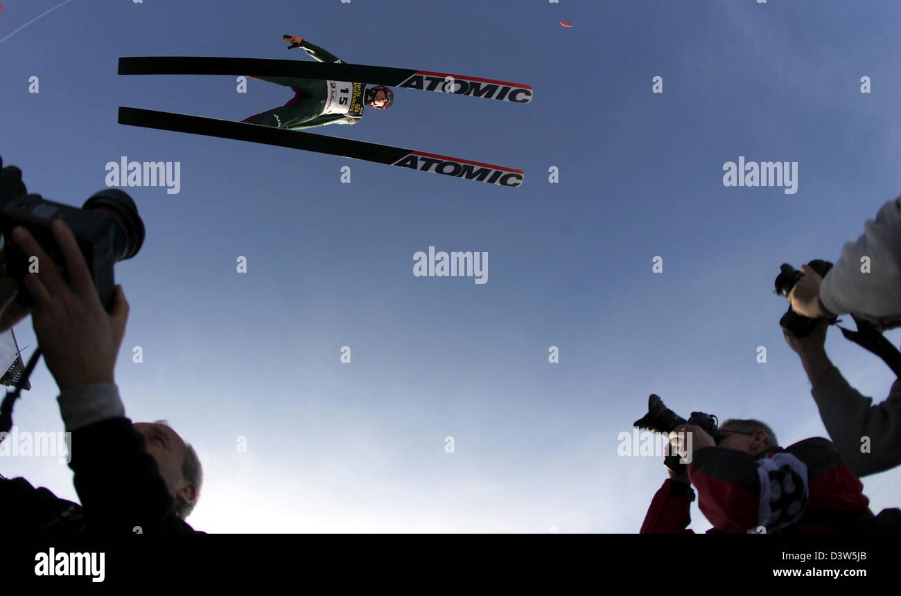 German ski jumper Maximilian Mechler jumps above the heads of cameras ...