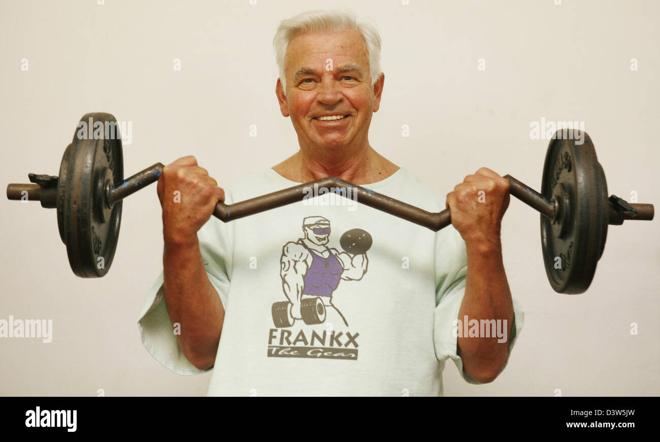 76 year-old bodybuilder Walter Klock works out with a barbell at a gym ...