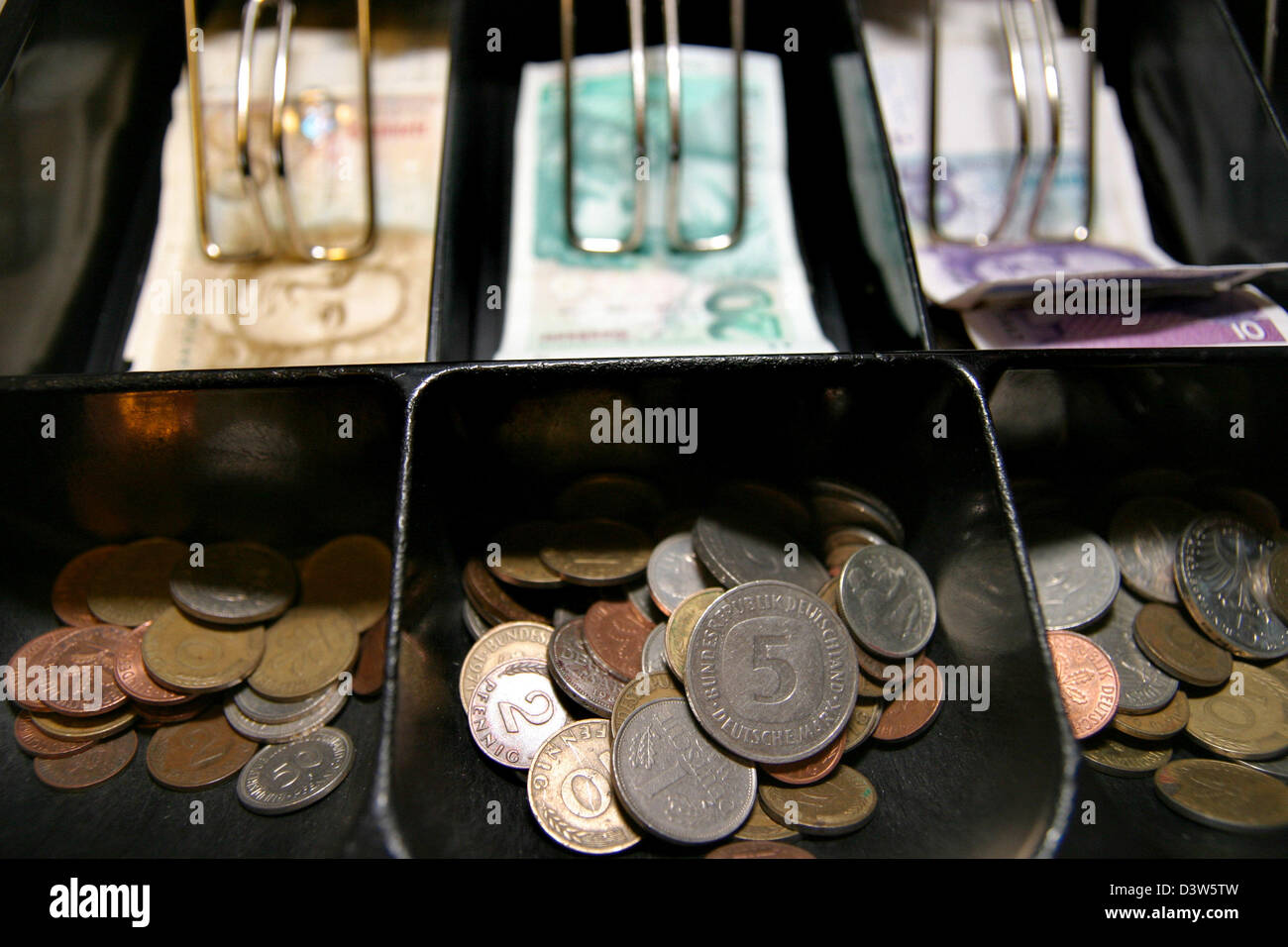 Deutschmark banknotes and coins pictured in the cashier of a kiosk in ...