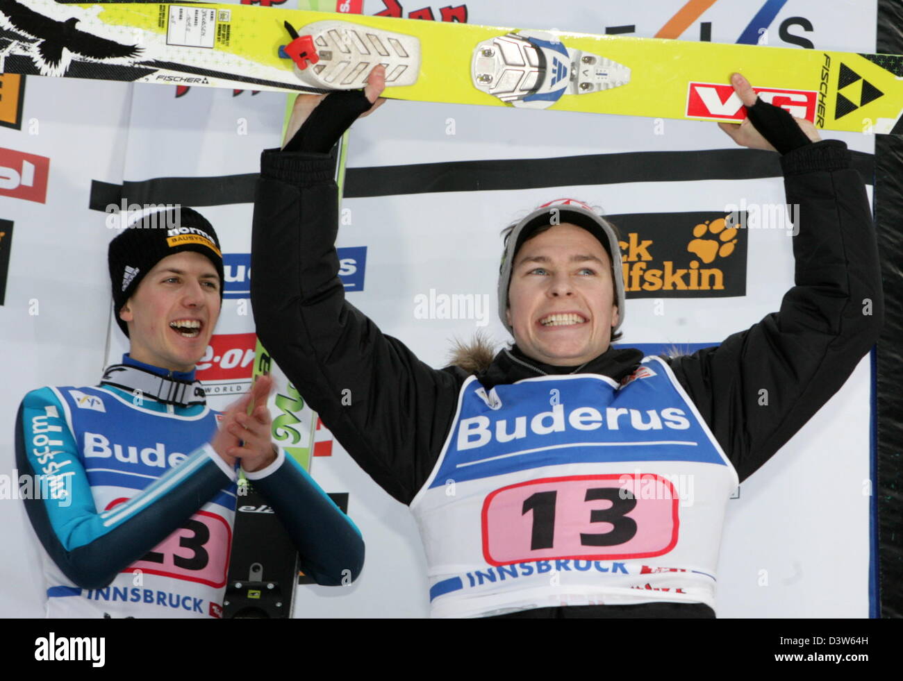 Norwegian Anders Jacobsen (R) celebrates his victory, while Swiss Simon ...