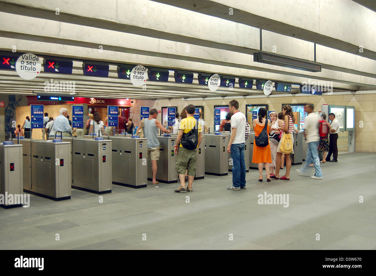 The automatic barriers at the entrance to a underground train stop are ...