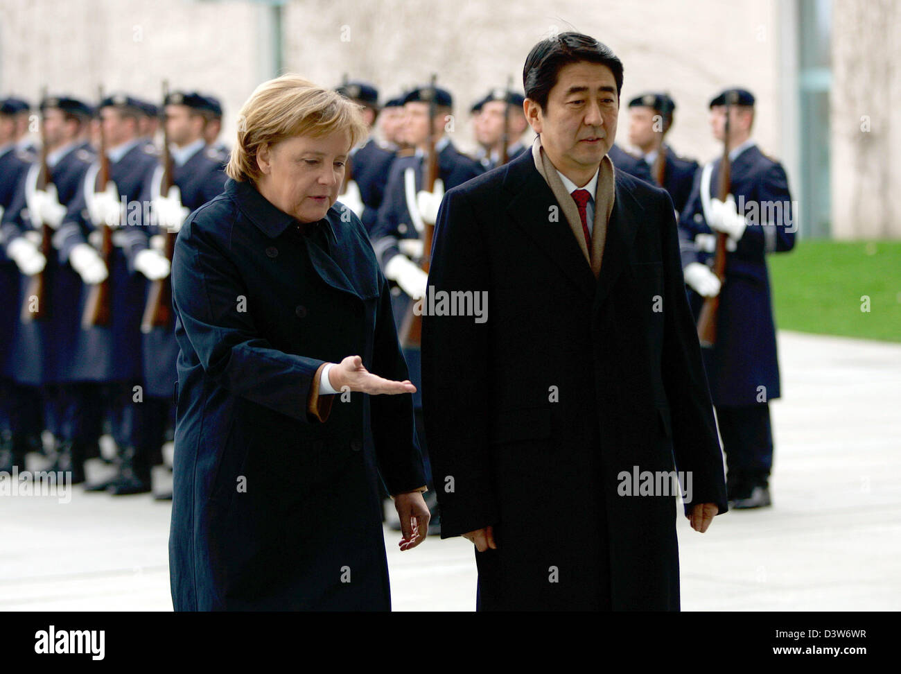 German chancellor Angela Merkel (front L) welcomes Japanese Prime ...