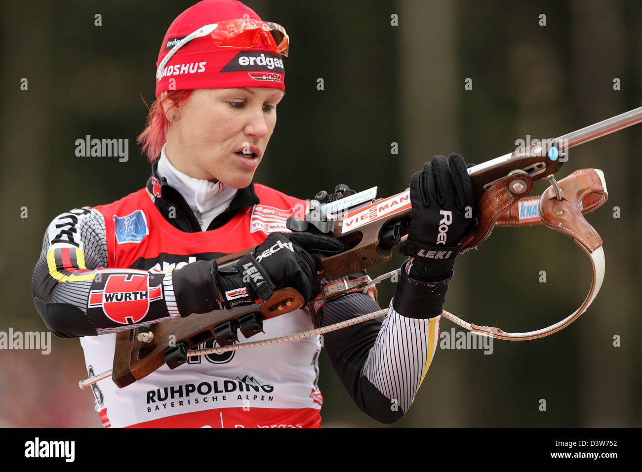 German biathlete Kati Wilhelm checks her rifle during the 7.5km sprint ...
