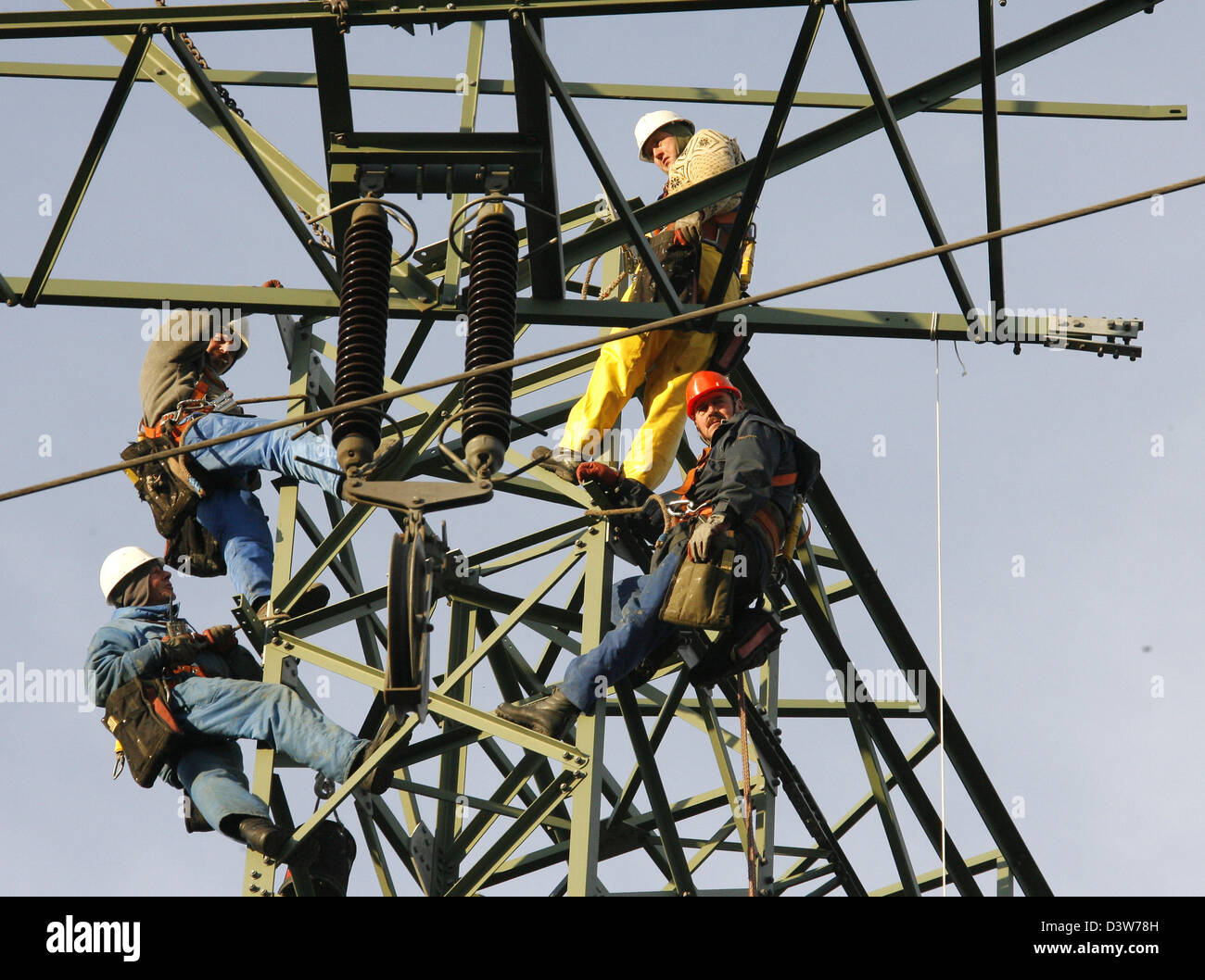 Staff of the FBG Freileitungsbau work on a 110 kV conductor in ...