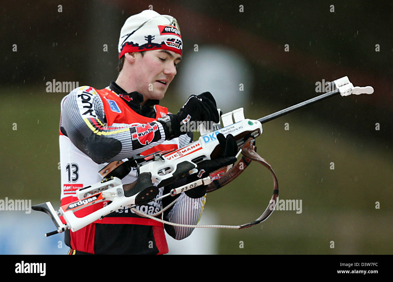 German Michael Roesch reloads his rifle during the men's 15 km mass ...