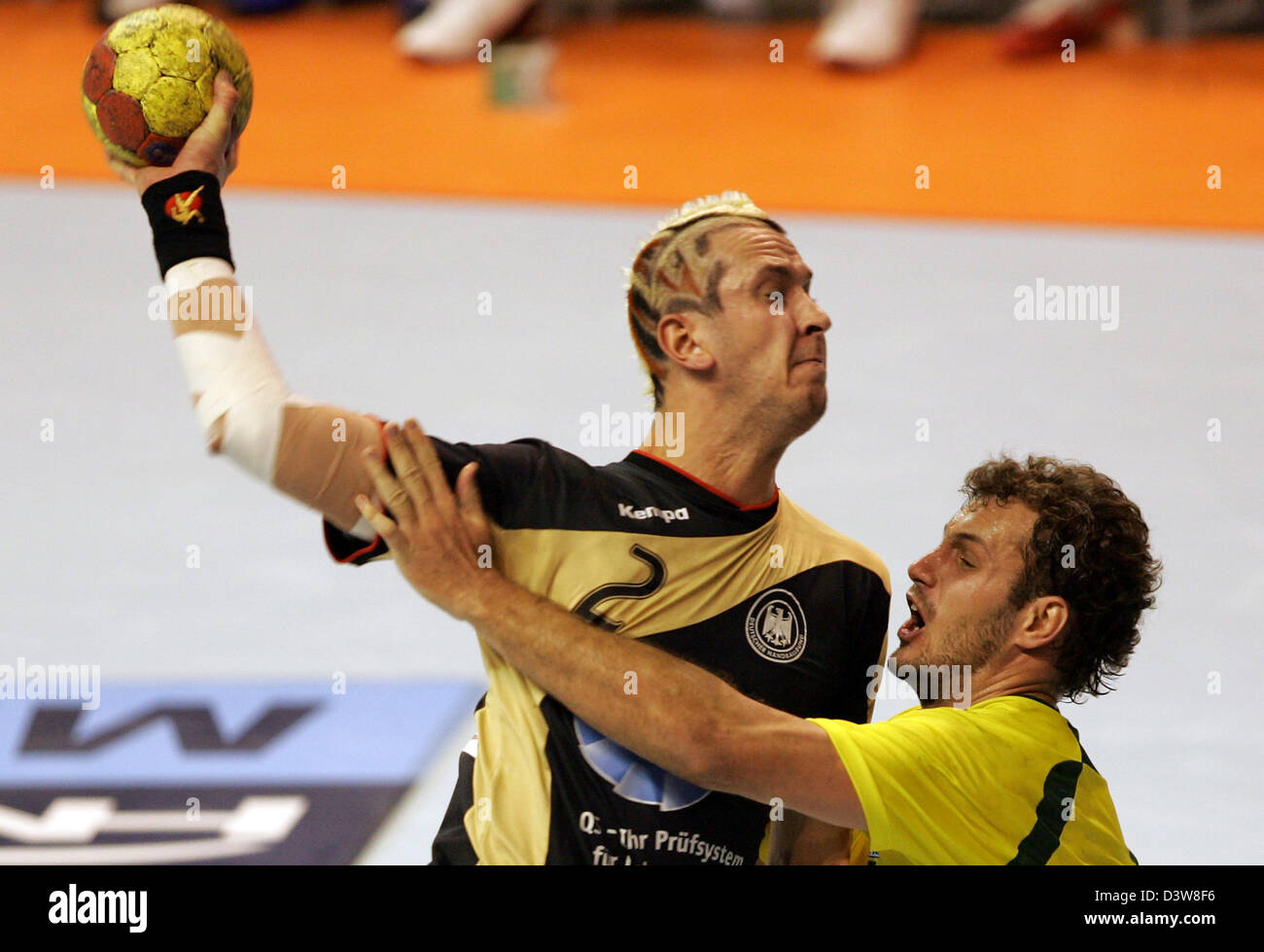 German international Pascal Hens (L) is blocked by Brazilian Fernando ...