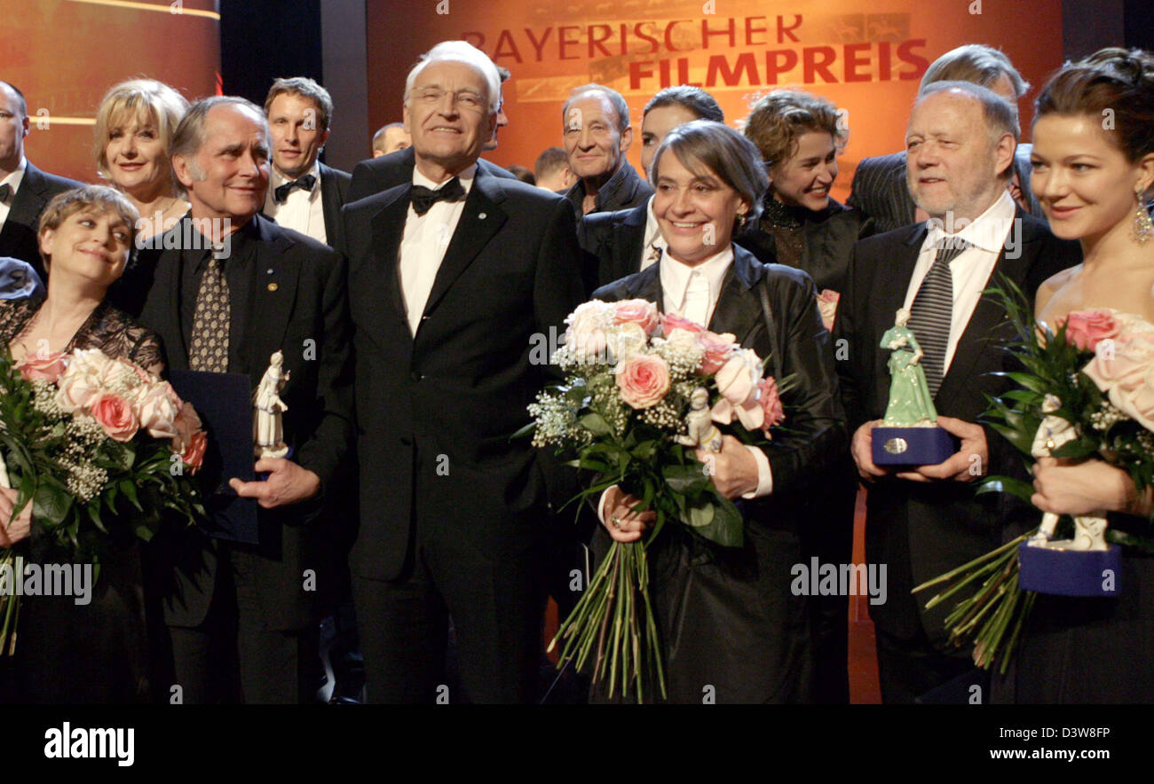 Bavarian Prime Minister Edmund Stoiber (C) stands on stage with actress ...