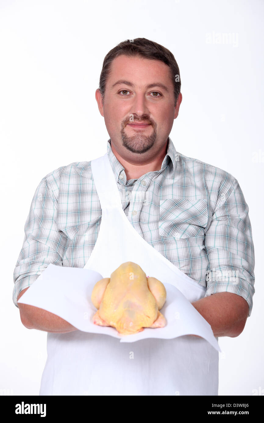 Butcher serving chicken Stock Photo - Alamy