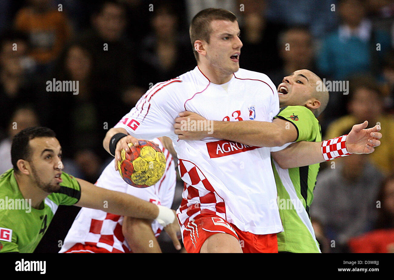 Slovenian player Ognjen Backovic (L) struggles for the ball with Rasmus ...
