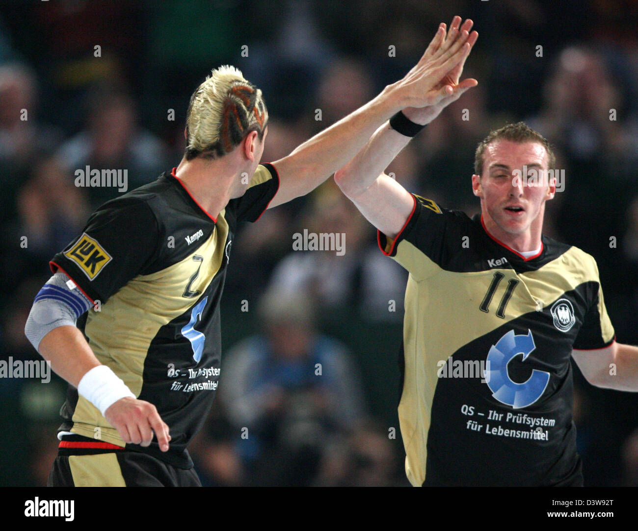 German internationals Pascal Hens (L) and Holger Glandorf celebrate a ...