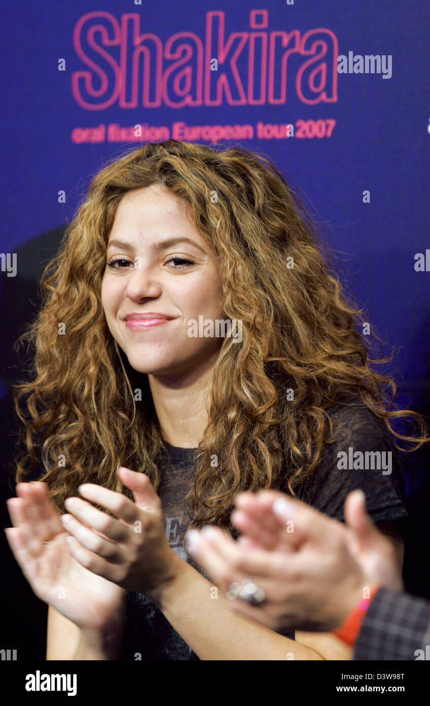 Colombian singer Shakira gives herself a hand at a press conference to ...