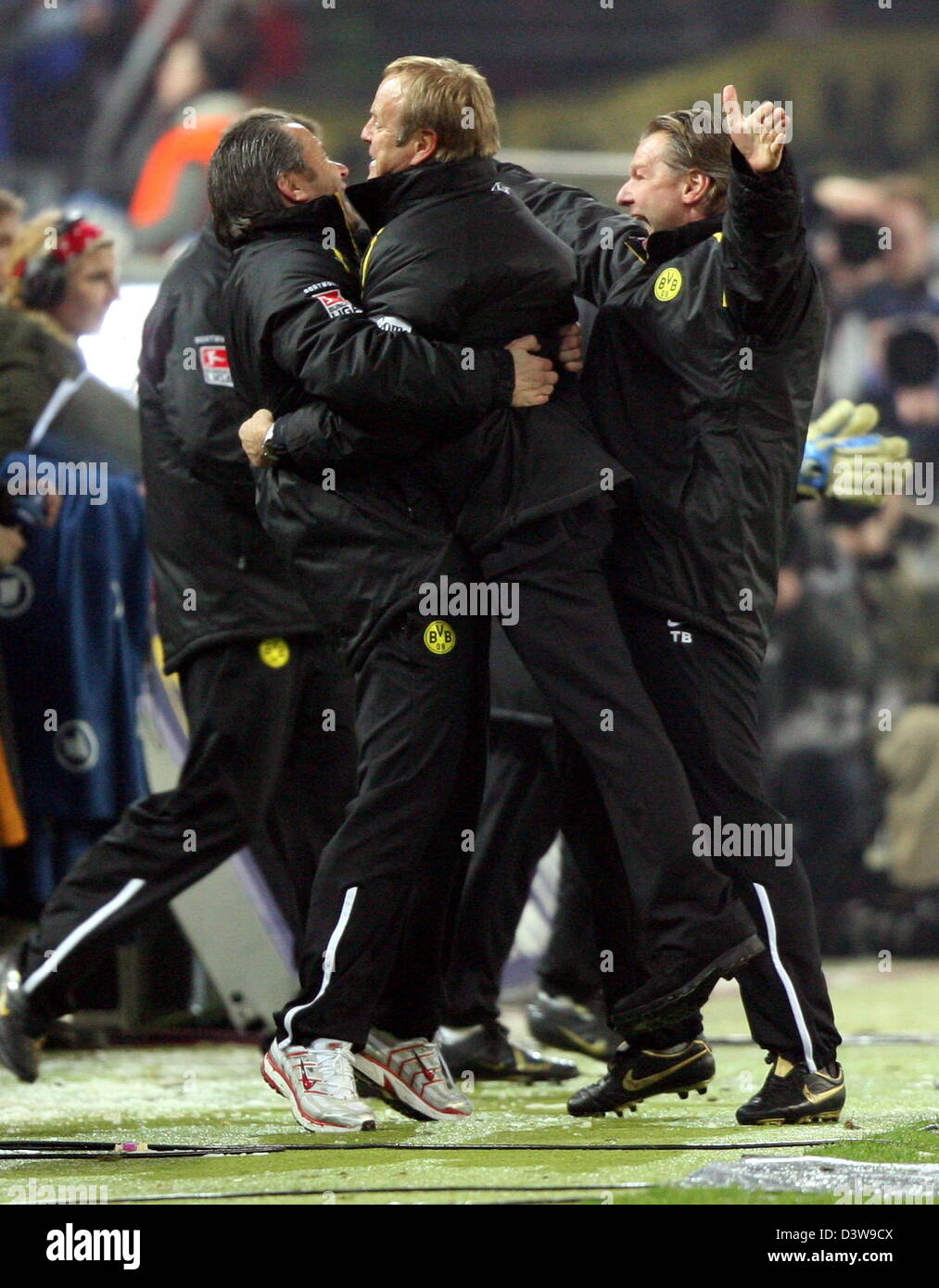 Dortmund's asisstant coachs Bernd Storck (L), Teddy de Beer (R) and ...
