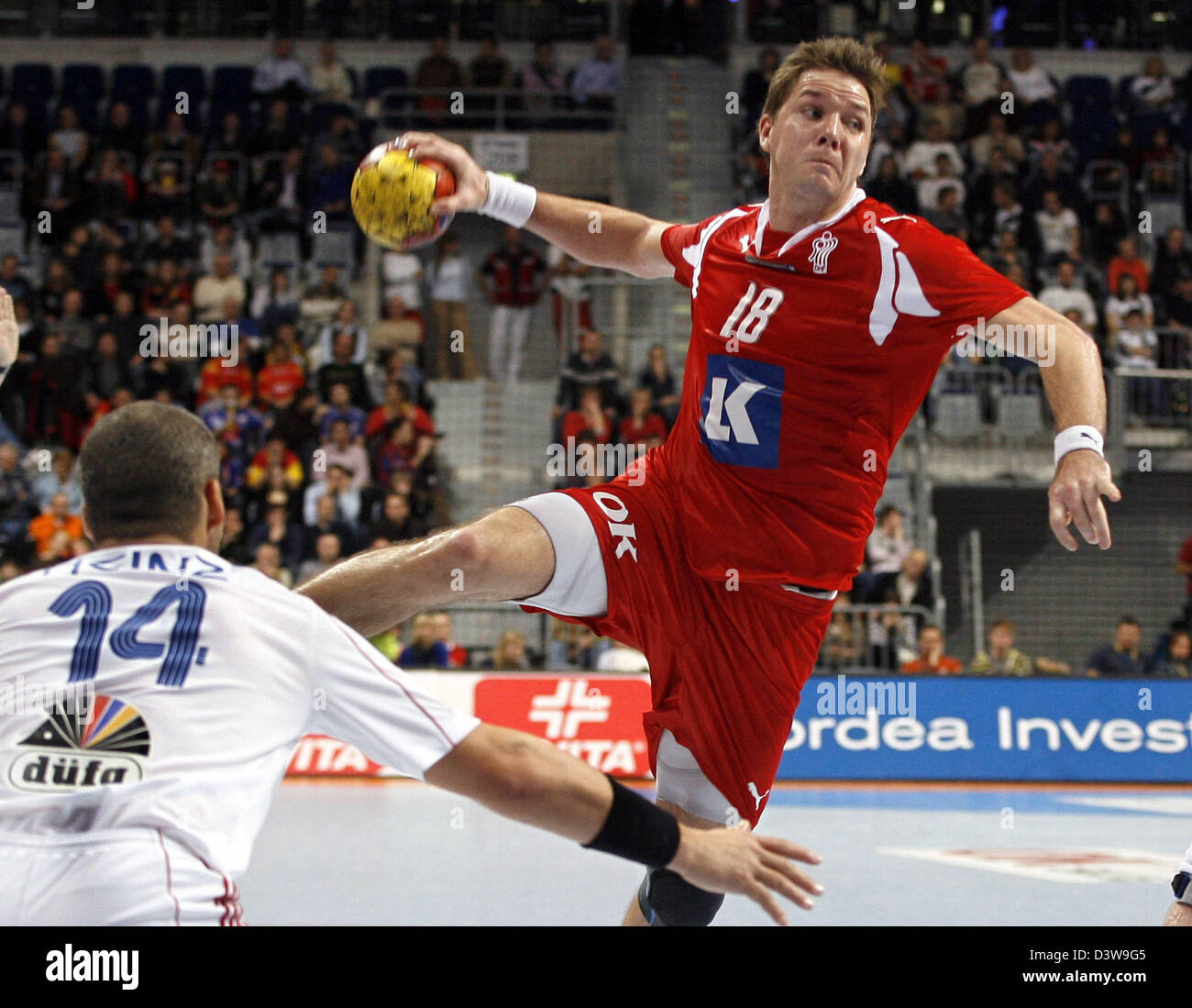 Danish Anders Oechsler (R) is about to throw the ball next to Tomas ...