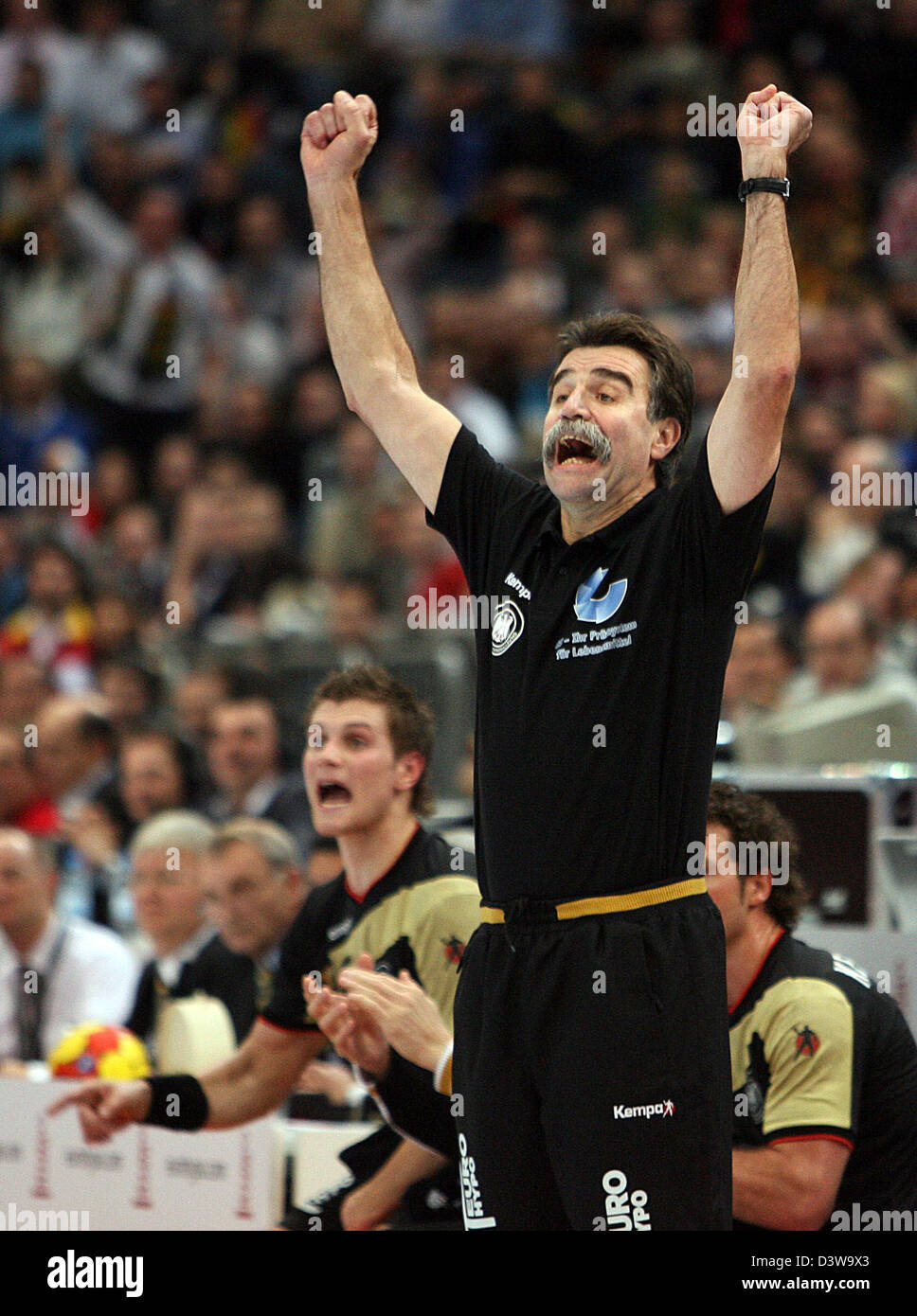 German head coach Heiner Brand cheers after Germany wins the Handball ...