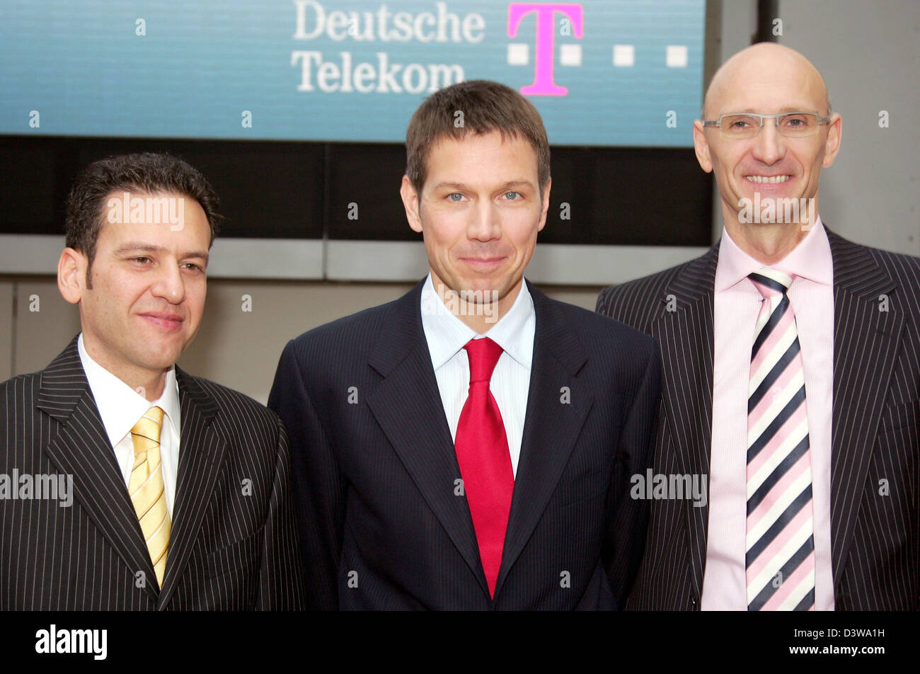 Deutsche Telekom CEO Rene Obermann (C), member of the board Hamid ...