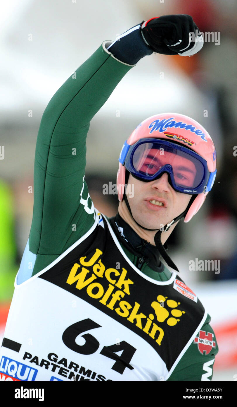 German ski jumper Michael Neumayer celebrates his superb second attempt ...