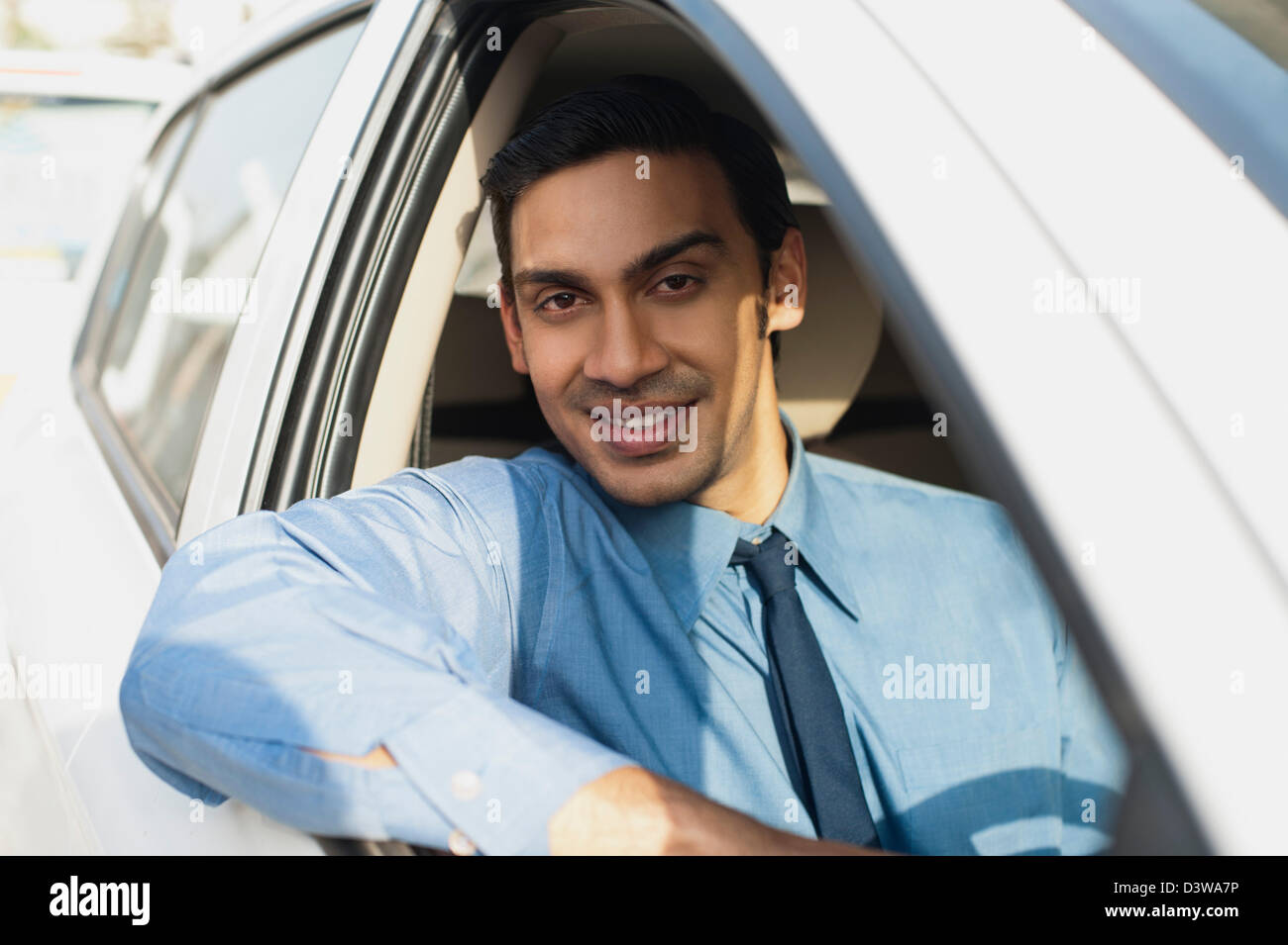 Bengali businessman driving a car Stock Photo - Alamy