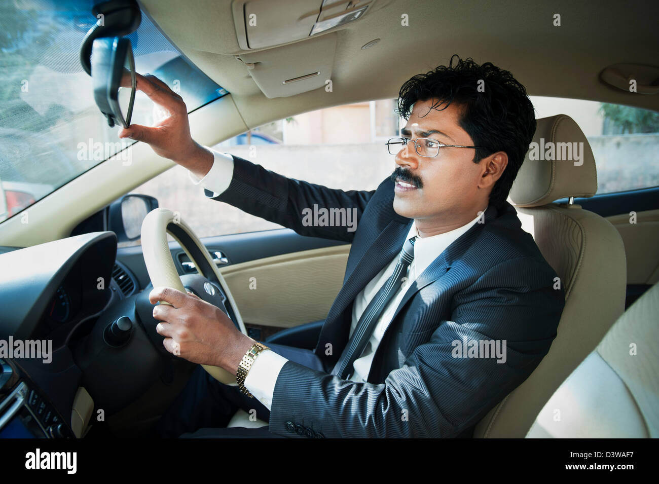 Indian man driving car hi-res stock photography and images - Alamy
