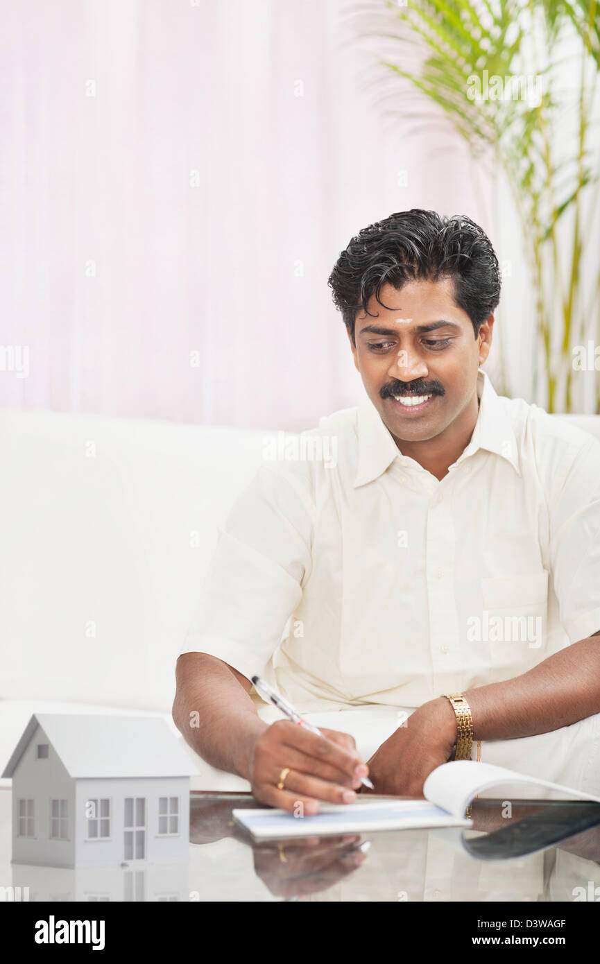 Indian man thinking holding pen hi-res stock photography and images - Alamy