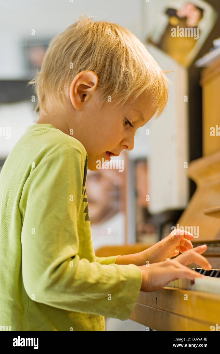 Blond Boy Playing Piano High Resolution Stock Photography and Images ...