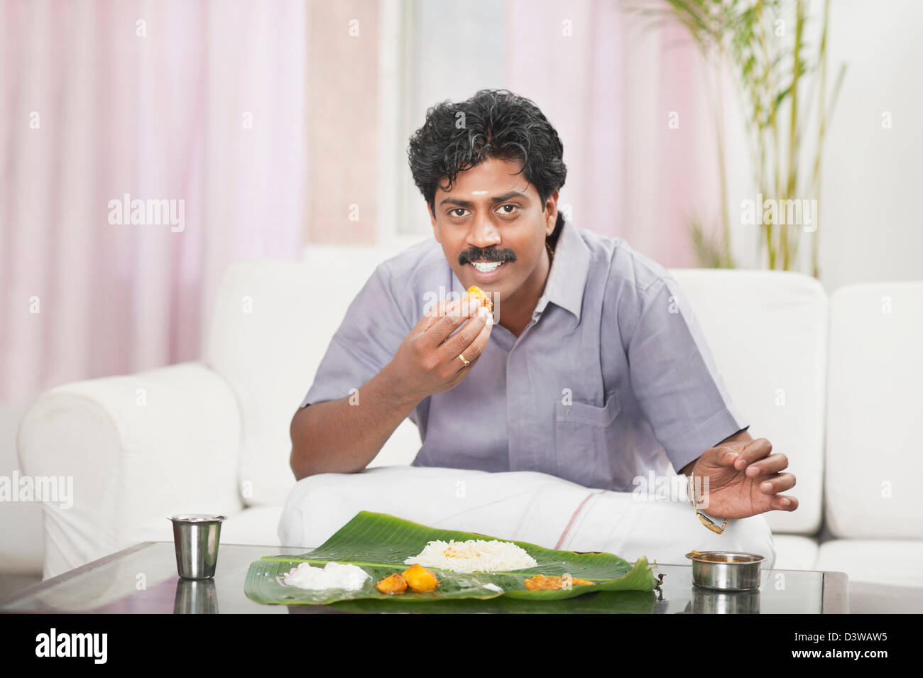 South Indian man having food Stock Photo - Alamy